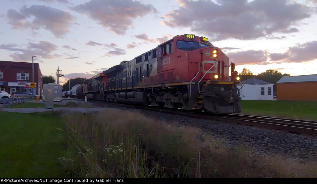 CN 3031 leads 482 rolling east through Richmond passing M-19 Crossings with nice sunset!